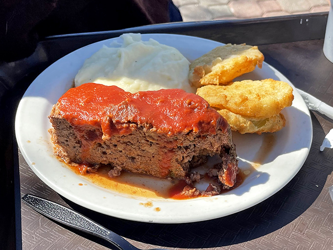 Meatloaf that would make your grandmother jealous, topped with tangy tomato sauce that demands to be sopped up.