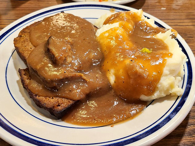 Meatloaf and mashed potatoes swimming in gravy&mdash;the kind of plate that makes you want to call your cardiologist and apologize in advance.