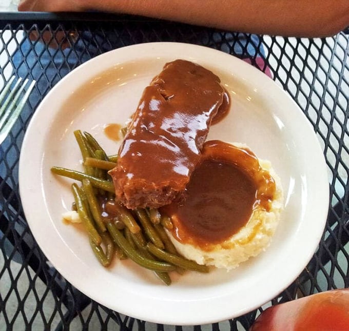 Meatloaf that would make your mother jealous, swimming in brown gravy and keeping excellent company with proper sides.