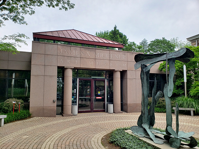The James A. Michener Art Museum's entrance welcomes art lovers with contemporary design and sculpture, proving small towns can deliver big cultural experiences.