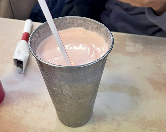This isn't just a milkshake; it's a silver chalice of dairy divinity that demands respect, patience, and strong straw technique.
