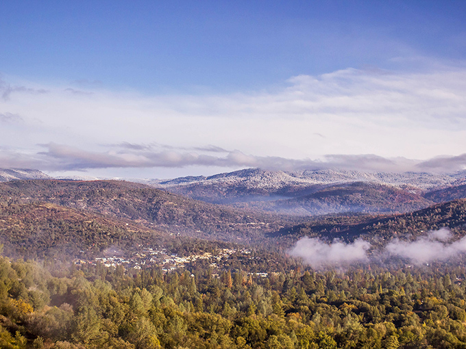Morning mist clings to the Sierra foothills like nature's cotton candy, creating the backdrop for Oakhurst's picture-perfect setting.