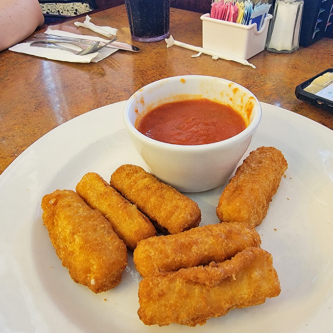 Mozzarella sticks: the universal language of appetizer love. Crispy on the outside, molten cheese within, and marinara sauce for that perfect tangy dip.
