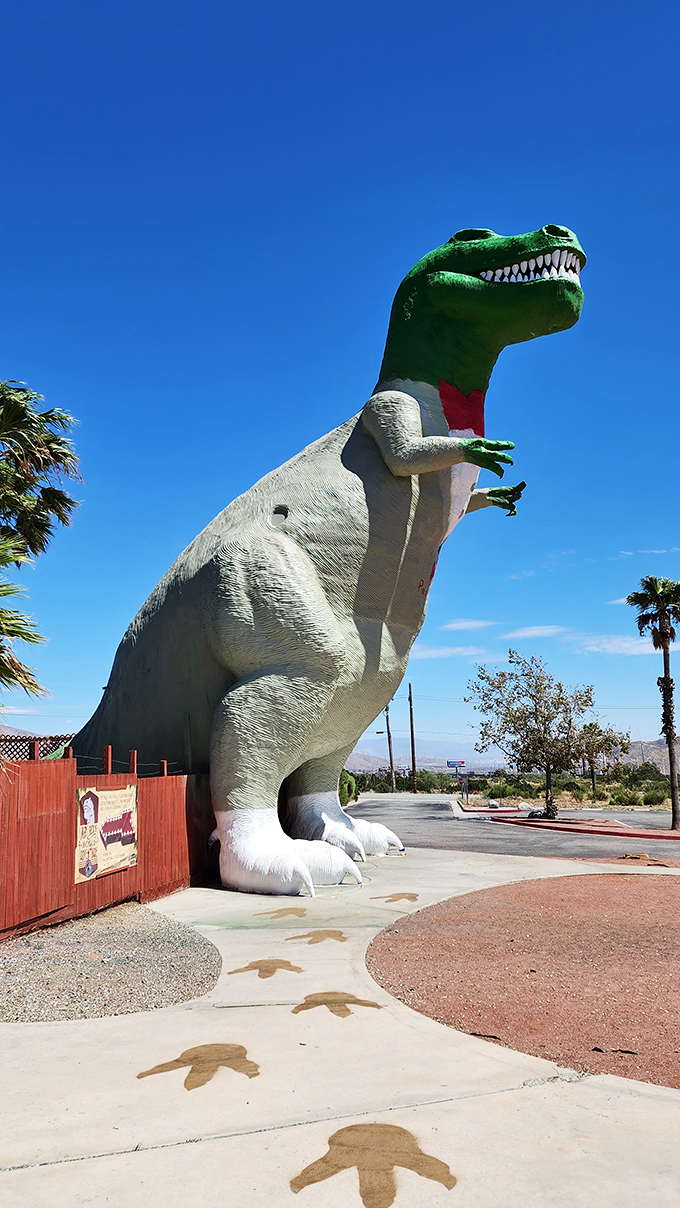 Footprints embedded in the concrete lead visitors toward the towering T-Rex &ndash; follow them if you dare, or if you need the perfect vacation selfie.