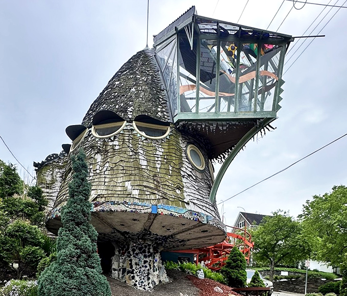 The tower section features porthole windows that seem to watch passersby, like a friendly sentinel keeping an eye on the neighborhood.