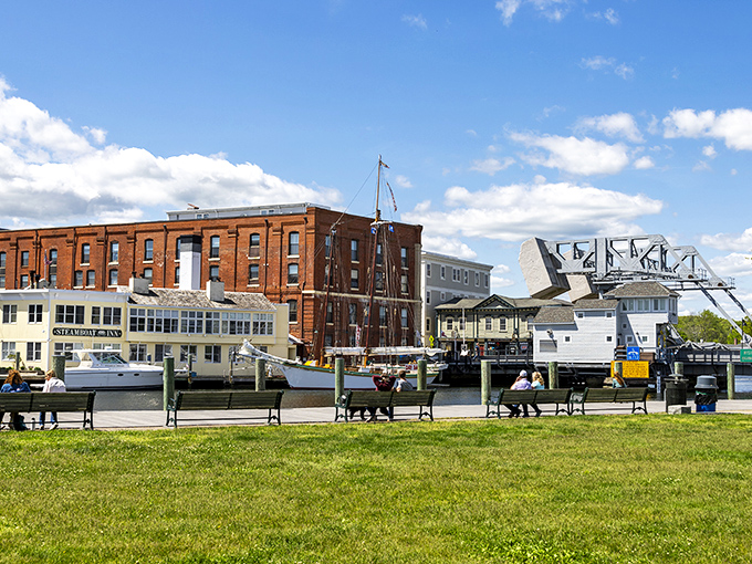 Mystic's waterfront combines working boats with leisure craft, creating that perfect postcard scene where maritime history meets modern relaxation.