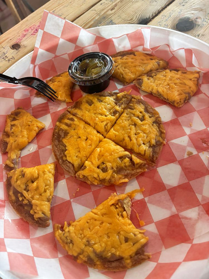 These nachos aren't playing around. The cheese-to-chip ratio here would make lesser nachos weep with inadequacy.
