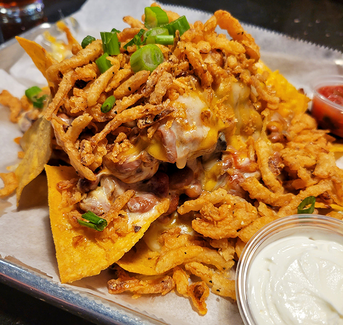 BBQ nachos that laugh in the face of utensils. This glorious mess of cheese, meat, and crunch demands to be tackled with both hands.