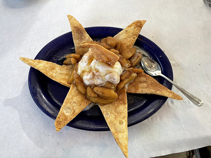 Dessert architecture at its finest. Crispy tortilla points create a star-shaped stage for warm apples and ice cream's final, delicious act.