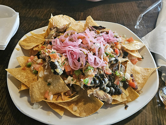 Nachos reimagined with smoky goodness and those pickled red onions on top? That's not a garnish&mdash;it's the crown jewel of this crunchy kingdom.