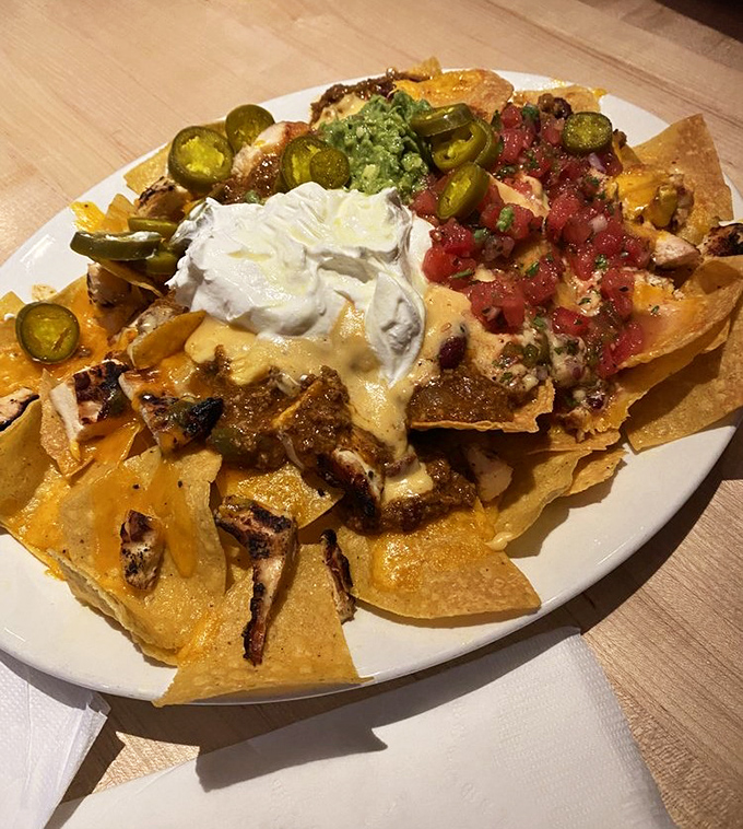 These loaded nachos aren't just a dish&mdash;they're an architectural achievement that would make Gaud&iacute; proud. A mountain of flavor with every possible topping.