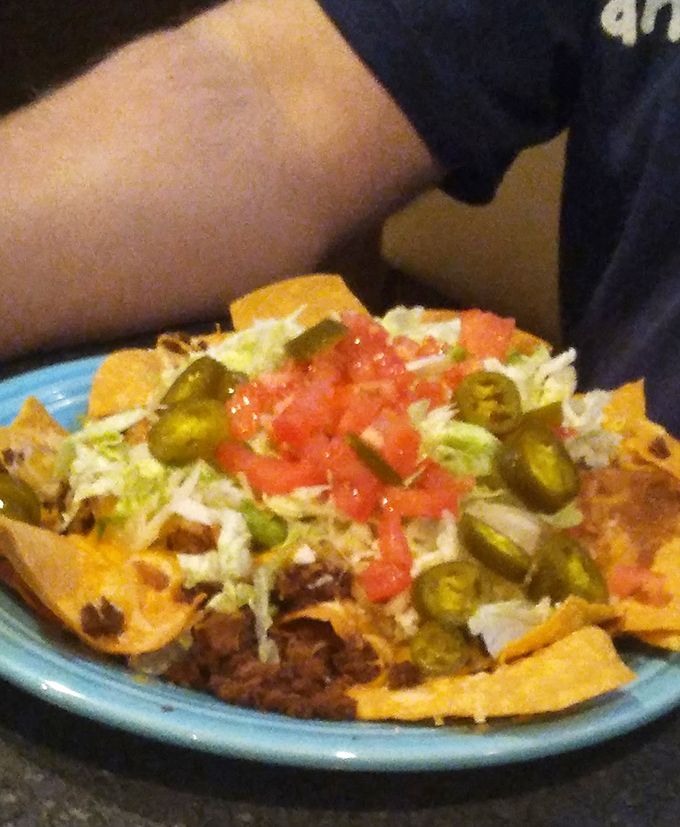Nachos that don't mess around &ndash; loaded with jalape&ntilde;os, tomatoes, and enough cheese to make Wisconsin proud. A shareable feast that rarely gets shared.