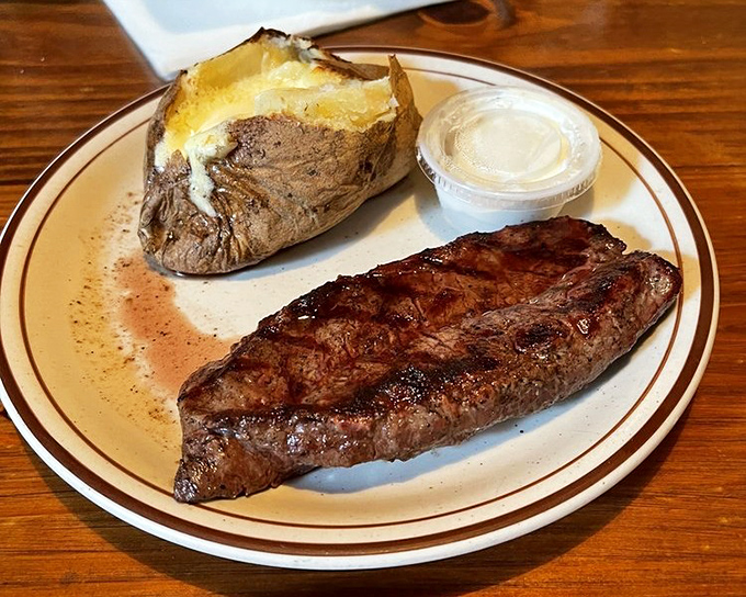 A New York strip and loaded baked potato - the Fred Astaire and Ginger Rogers of steakhouse pairings, dancing perfectly across your taste buds.