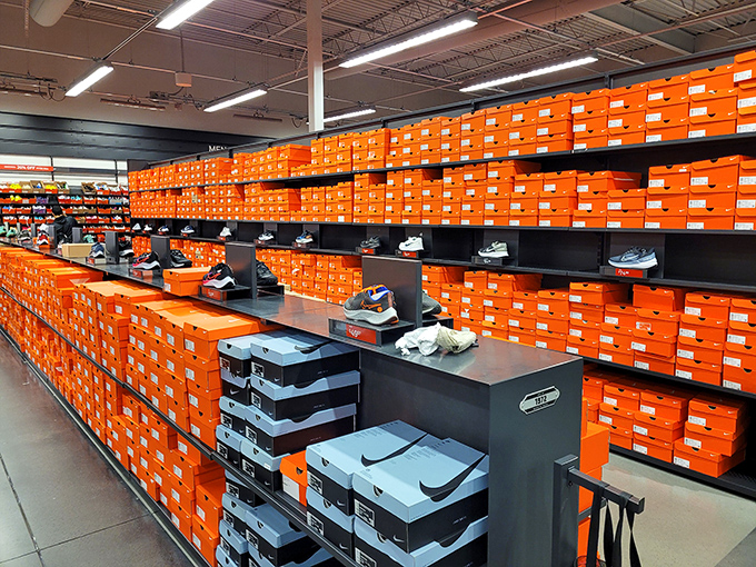The Nike outlet's wall of orange boxes stands like the retail equivalent of the Great Pyramid&mdash;a monument to athletic aspirations and markdown magic.