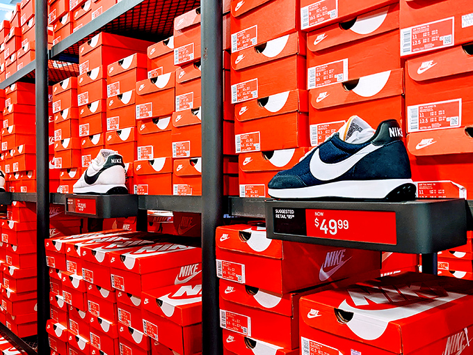 The wall of orange Nike boxes might as well be Fort Knox for sneakerheads. That $49.99 price tag is the real MVP.