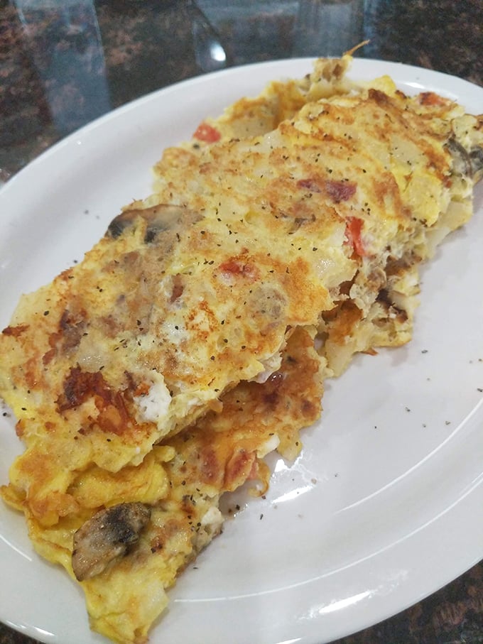This omelet doesn't just contain mushrooms and peppers &ndash; it celebrates them in a fluffy egg embrace.