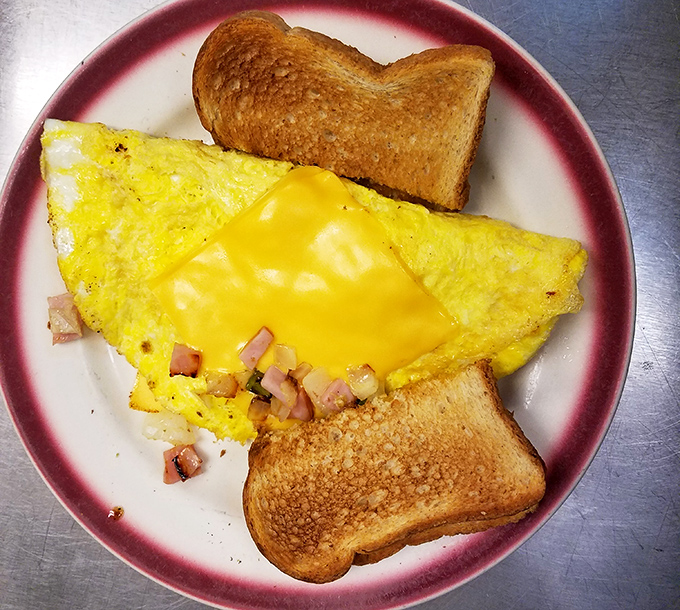 This isn't just breakfast&mdash;it's morning salvation. The perfectly folded omelet with ham cubes nestled inside makes those fancy brunch spots seem unnecessarily complicated.