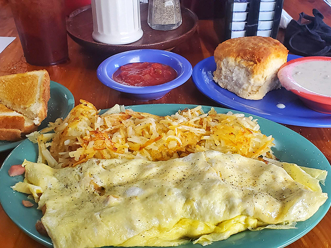 Breakfast dreams come true with this perfect omelet&mdash;fluffy, golden, and served with hashbrowns that achieve that ideal crispy-outside, tender-inside balance.