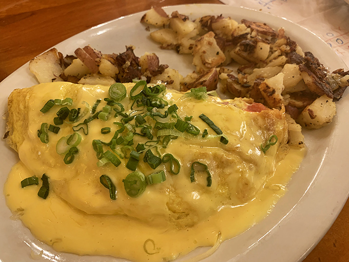 An omelet dressed in hollandaise, proving that sometimes more really is more when it comes to breakfast.