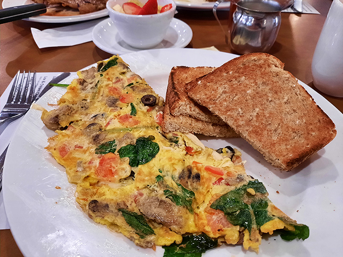 An omelet that doesn't just fill your stomach but nourishes your soul. Vegetables hiding inside eggs never looked so inviting.