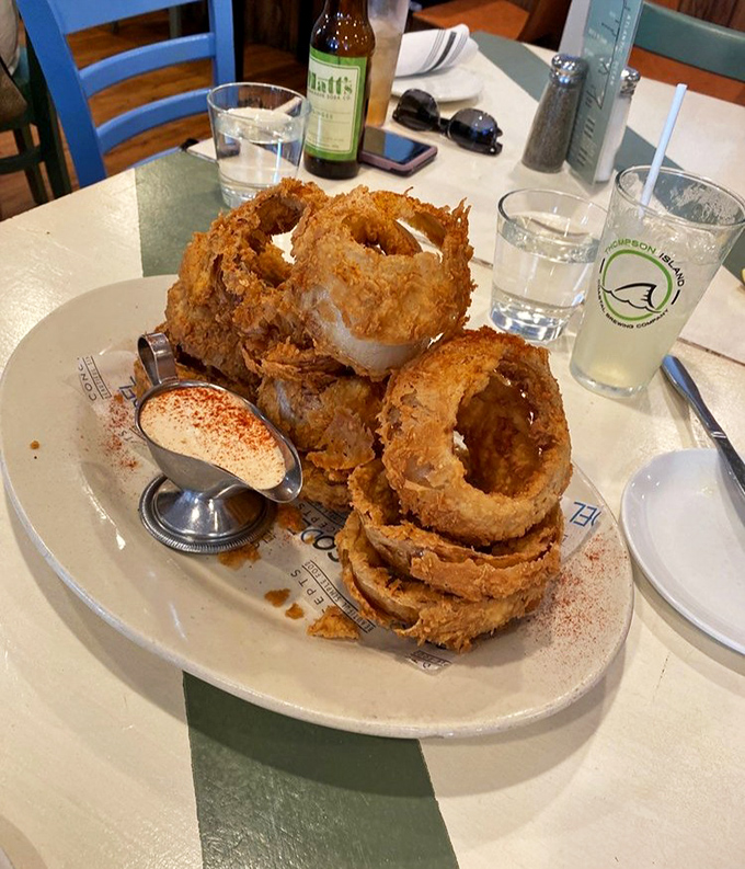 These onion rings aren't just fried &ndash; they're golden halos of crunch that make you wonder why we don't build monuments to simple pleasures.