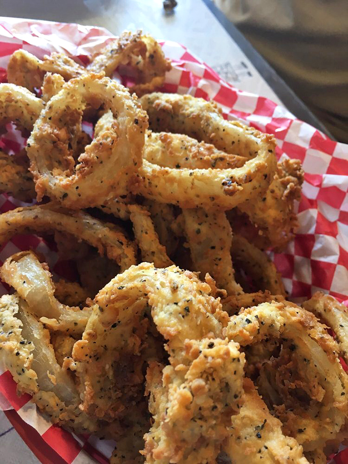 These aren't just onion rings; they're golden halos of crispy perfection. Thick-cut, beer-battered, and fried until they achieve that satisfying crunch that echoes across the Hill Country.