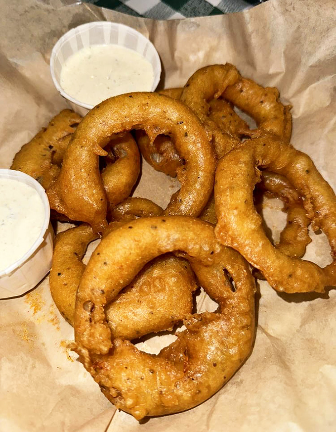 These aren't your average onion rings; they're crispy golden halos of flavor that deserve their own fan club.
