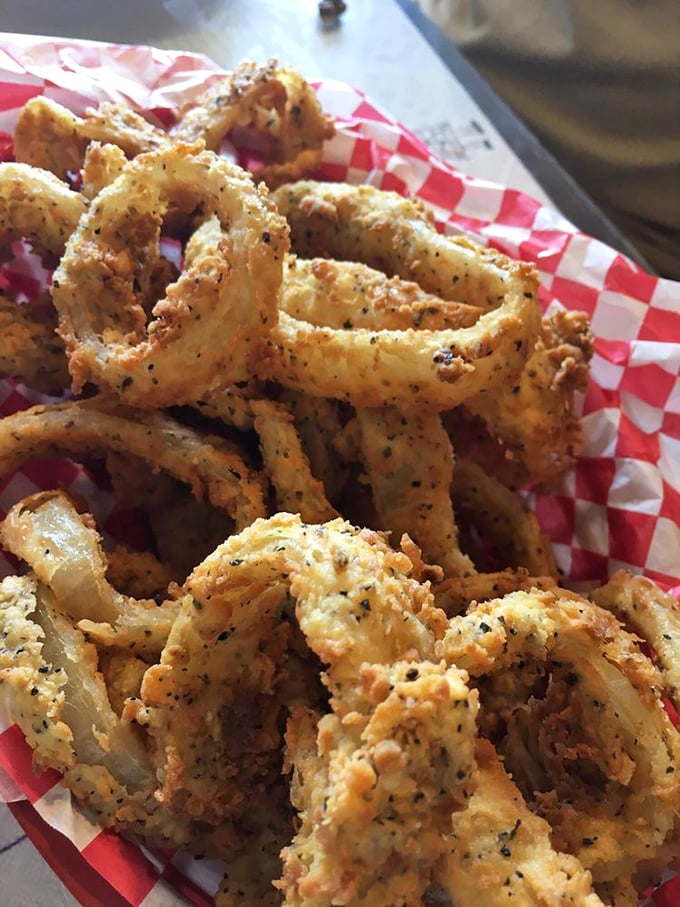 These aren't just onion rings; they're golden halos of crispy perfection. Thick-cut, beer-battered, and fried until they achieve that satisfying crunch that echoes across the Hill Country.