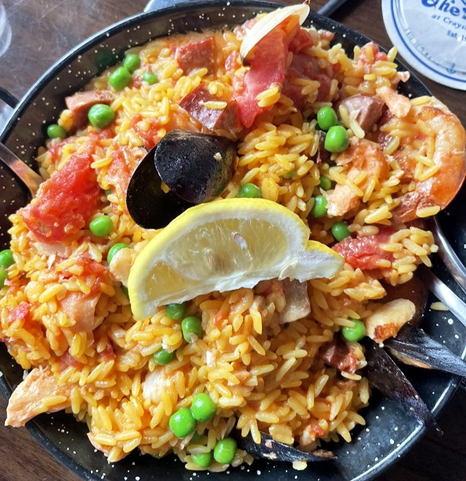 This isn't just paella—it's a sunset in a skillet, where saffron rice meets seafood in a romance worthy of a beach novel.