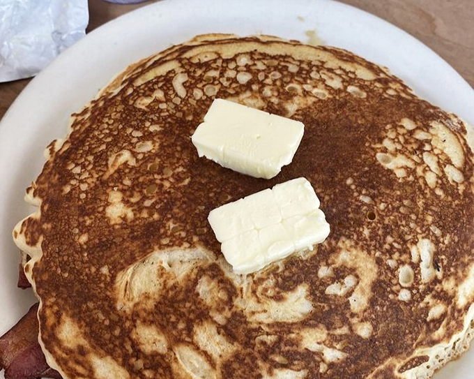 This pancake isn't just breakfast, it's architecture &ndash; a golden-brown foundation topped with butter that's melting into warm, fluffy perfection.