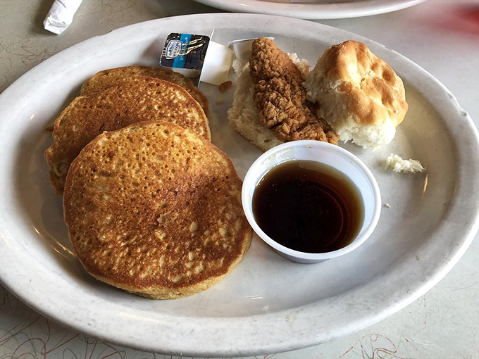 These pancakes aren't just round, they're well-rounded citizens of Breakfast Republic, flanked by their faithful companions: syrup, biscuit, and country-fried sidekick.