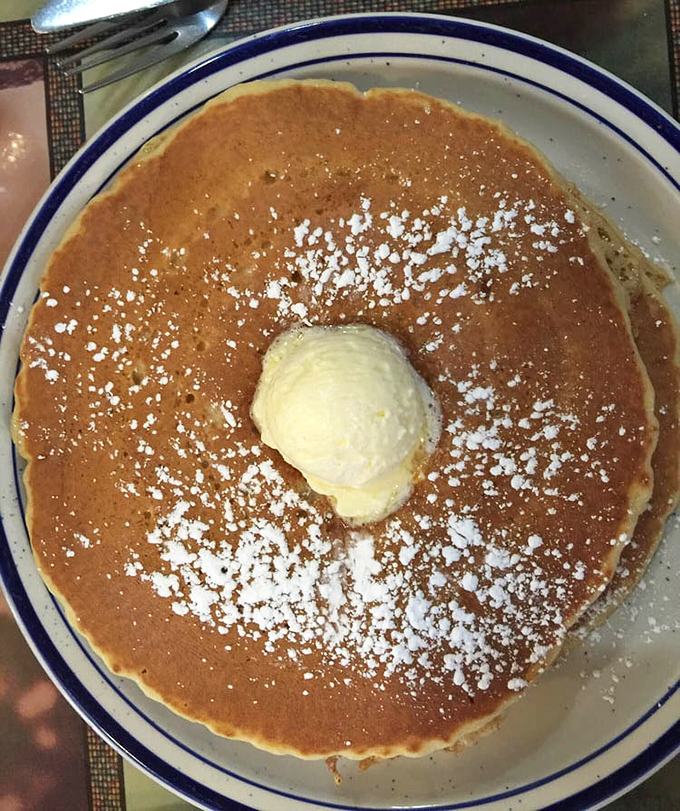 This isn't just a pancake&mdash;it's a golden canvas of possibility, dusted with powdered sugar and crowned with a melting butter throne.