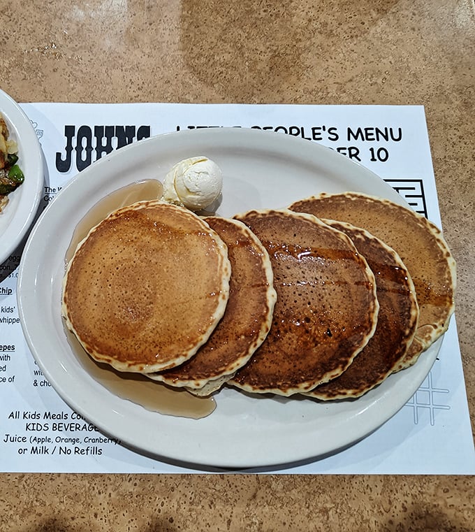 These perfectly golden pancakes arrive with a scoop of butter slowly melting into their warm embrace &ndash; the breakfast equivalent of a standing ovation.