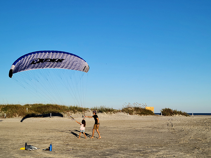 Flight school, beach edition. Nothing says "I'm living my best life" like learning to paraglide on Folly's wide-open sandy runway.