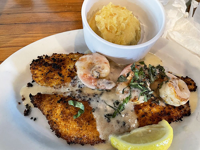 The Parmesan crusted flounder comes dressed for success with plump shrimp in a supporting role that deserves its own standing ovation.