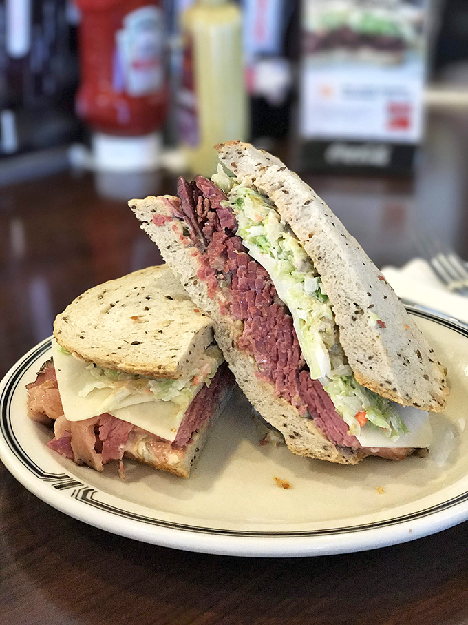 The #19 pastrami sandwich in all its glory&mdash;hand-cut meat, Swiss cheese, and coleslaw creating the holy trinity of deli perfection.
