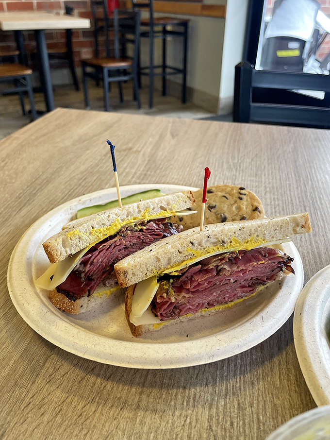 This isn't just a sandwich &ndash; it's a skyscraper of pastrami architecture, where each floor is more delicious than the last. 