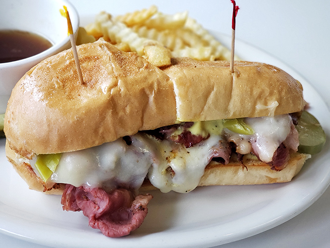 This pastrami sandwich towers like a delicious skyscraper, proving that lunch can be just as impressive.