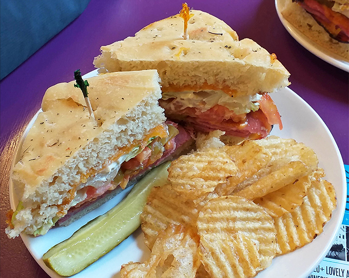 Architecture matters in sandwiches too. This perfectly constructed creation, with its golden focaccia and generous filling, comes with the bonus of house-made chips.