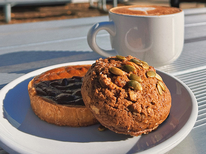 This pumpkin seed-topped muffin and cappuccino duo isn't just breakfast; it's edible therapy that costs less than a session with your therapist.