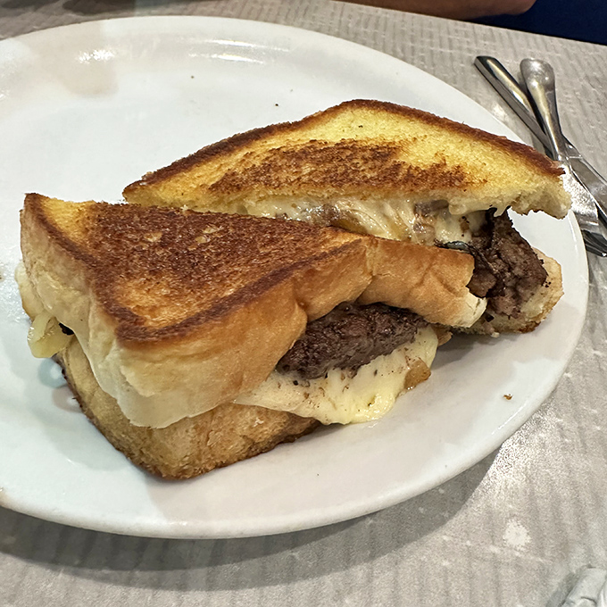This isn't just a patty melt&mdash;it's what happens when bread, beef, and cheese have a beautiful reunion. Crispy, gooey perfection on a plate.