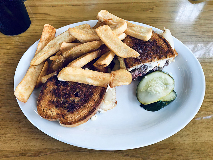A patty melt that proves lunch deserves equal attention, with fries that could star in their own show.