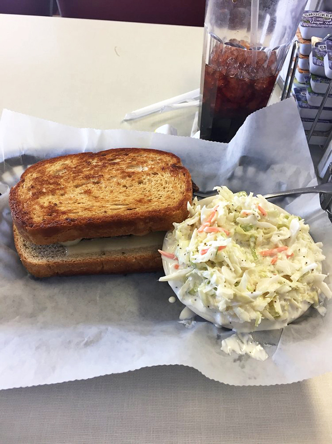 The humble patty melt arrives with a side of coleslaw so fresh it could start its own farmers market.