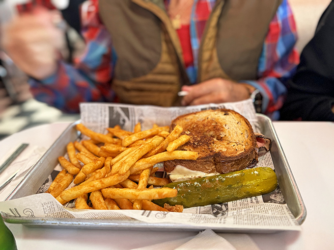 This isn't just a sandwich; it's a masterpiece of melted cheese, toasted bread, and crispy fries that would make any lunch counter proud.