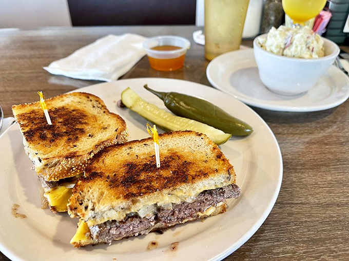 The patty melt: where burger meets grilled cheese in a beautiful marriage that would make any cardiologist nervously check their calendar.