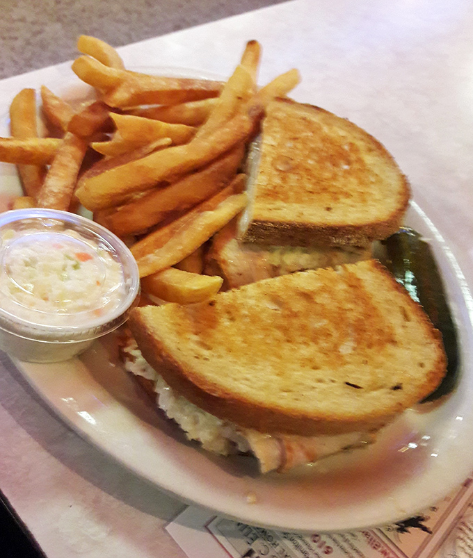 This isn't just a sandwich&mdash;it's architecture. Golden-grilled bread, melty cheese, and crispy fries create the comfort food trifecta we all crave.