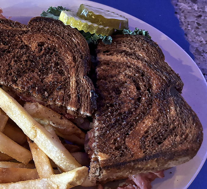 The patty melt&mdash;that perfect marriage of toasted rye, melted cheese, and beef&mdash;served with fries that look like they're auditioning for a food commercial.