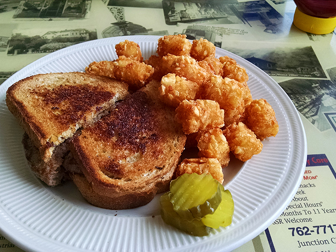 The patty melt &ndash; that perfect marriage of beef, bread, and cheese &ndash; served with tater tots that crunch like childhood memories. Simple perfection on a plate.