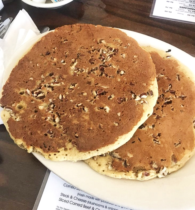 These pecan pancakes aren't just breakfast, they're an event. The nuts aren't decoration—they're VIP guests at the pancake party of the year.