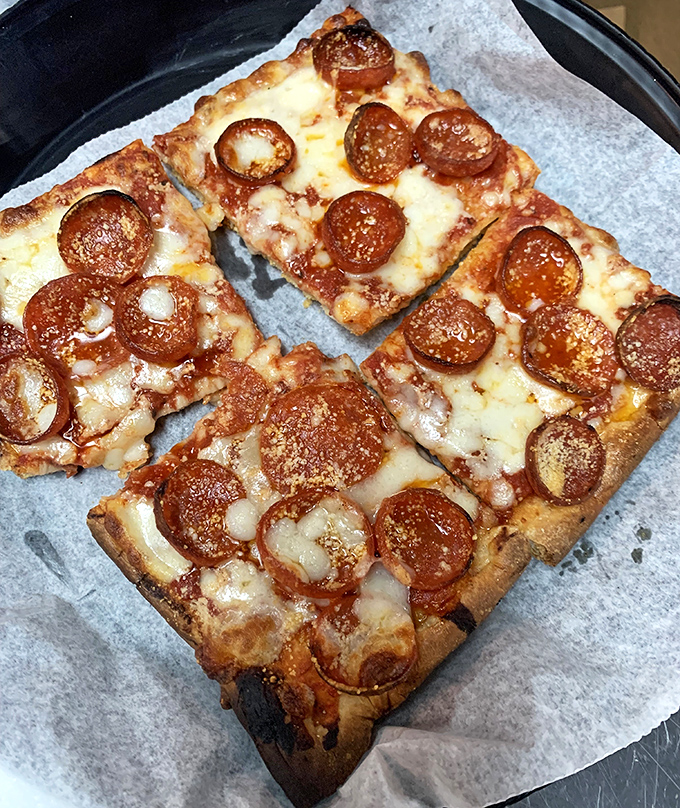 Those pepperoni cups crisp up at the edges, creating tiny pools of flavor that would make even the most jaded New Yorker pause mid-complaint.